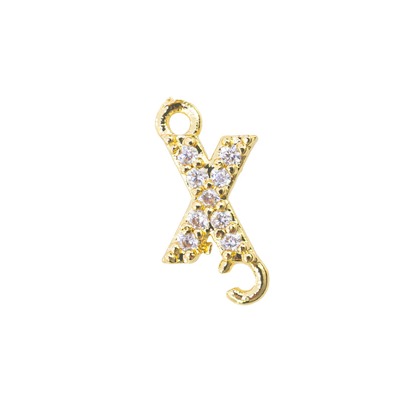 Separador con Circonia Letra X 11x7mm Dorado – KARATI